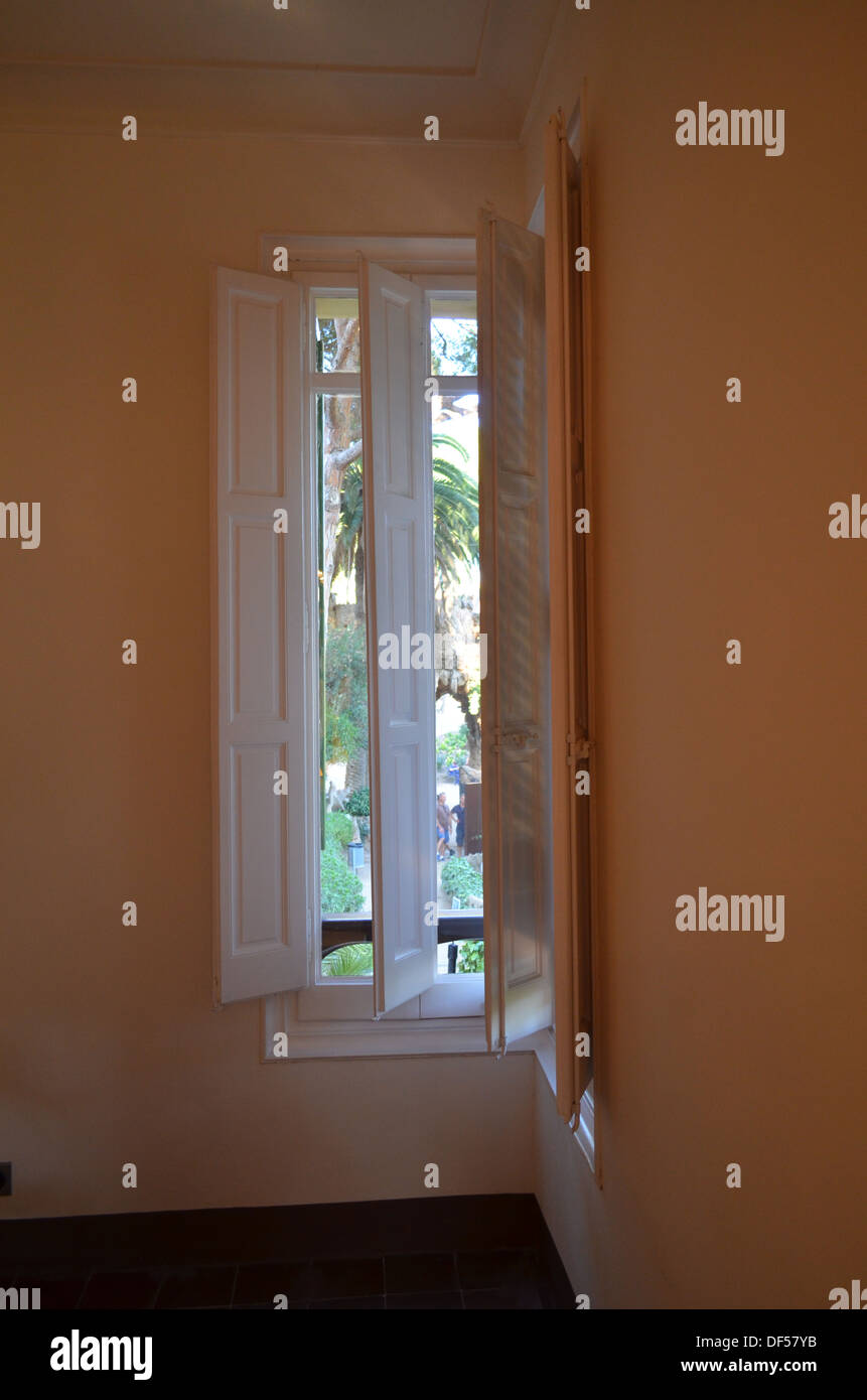 Corner window with wood shutters Stock Photo - Alamy
