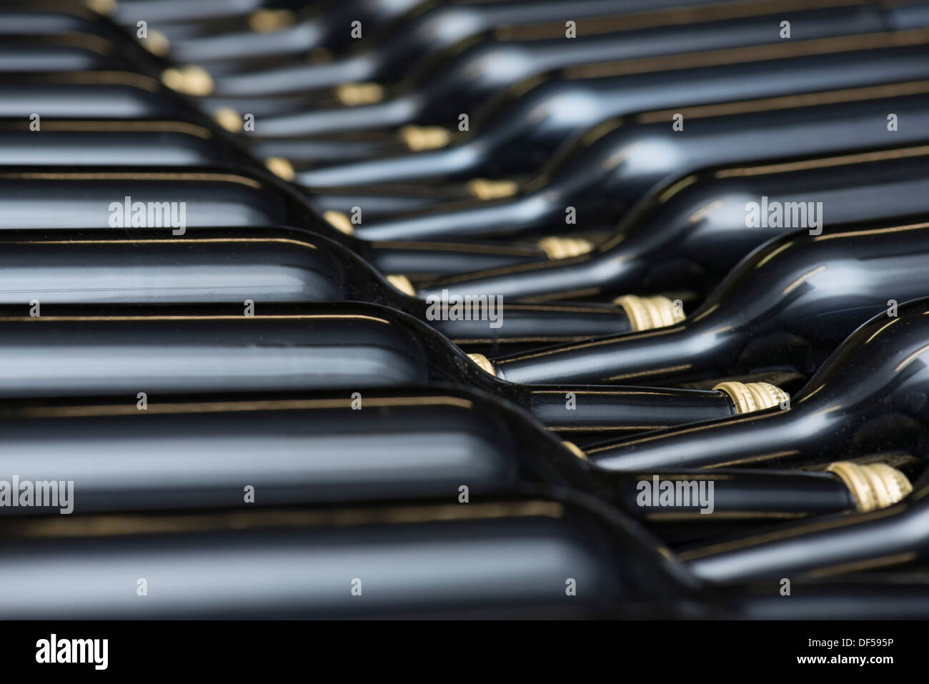 Many of Wine Bottles In A Row Stock Photo - Alamy