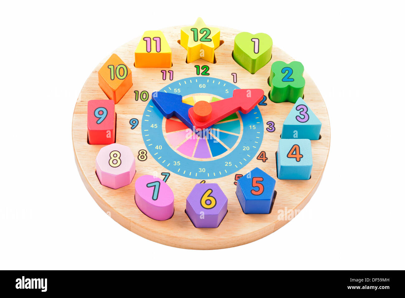 child's toy wooden clock with colourful number shapes on a white ...