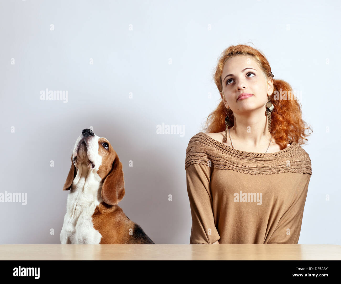 girl with red hair and cute beagle Stock Photo - Alamy