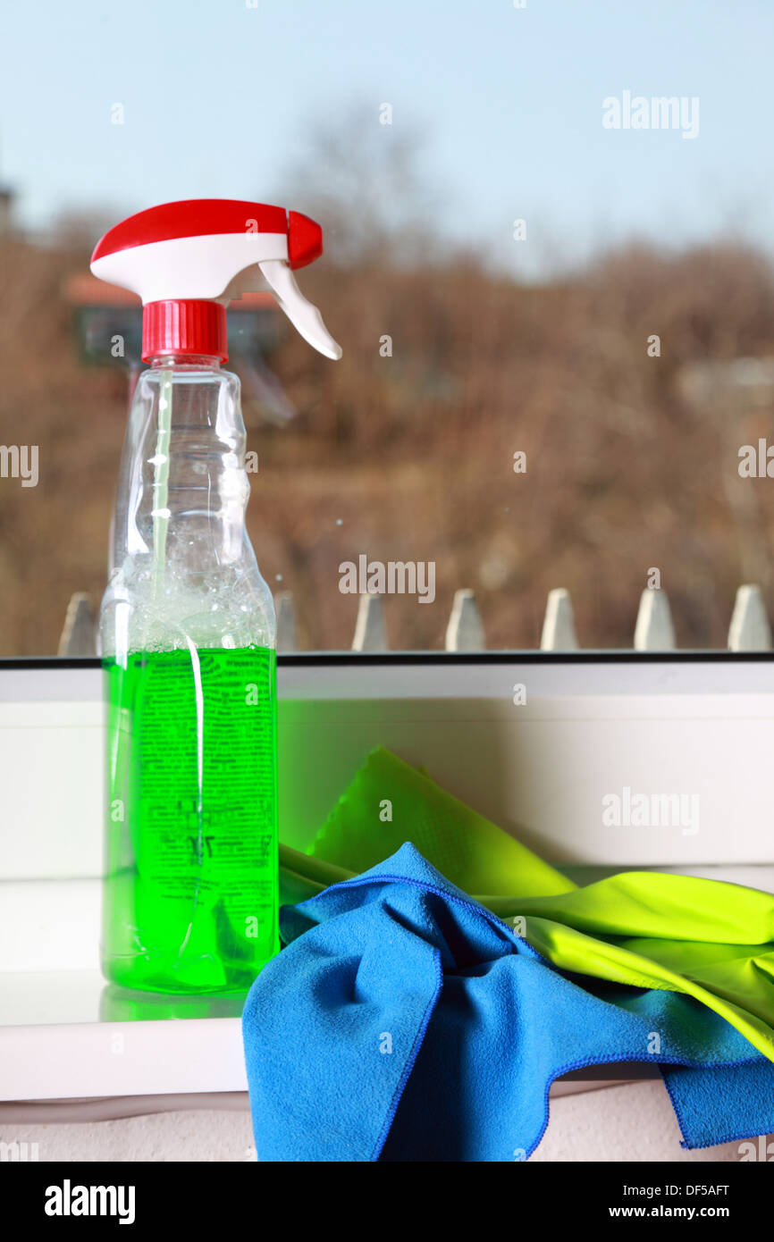 Cleaning window using tools - rag and spray detergent. Spring cleaning ...