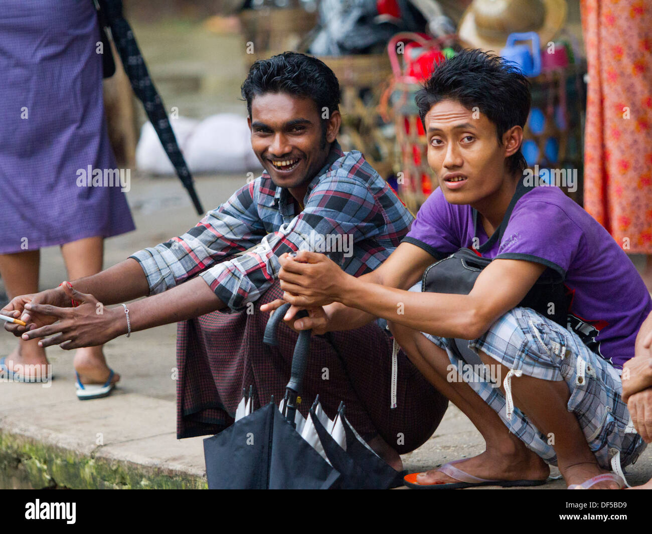 Men squat in a railway station in yangon hi-res stock photography and ...