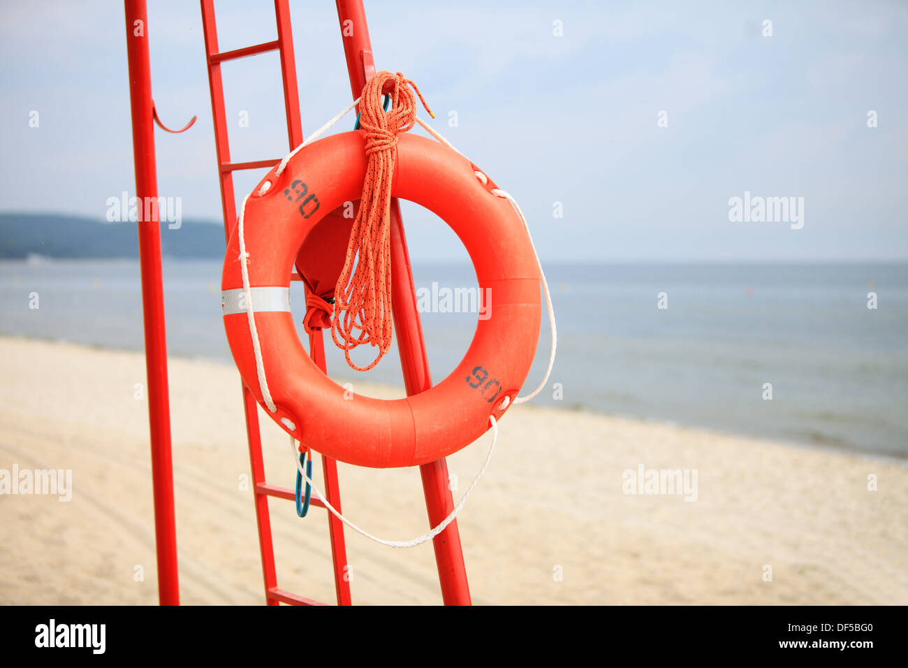 Beach life-saving. Lifeguard rescue equipment orange lifebuoy buoyancy ...
