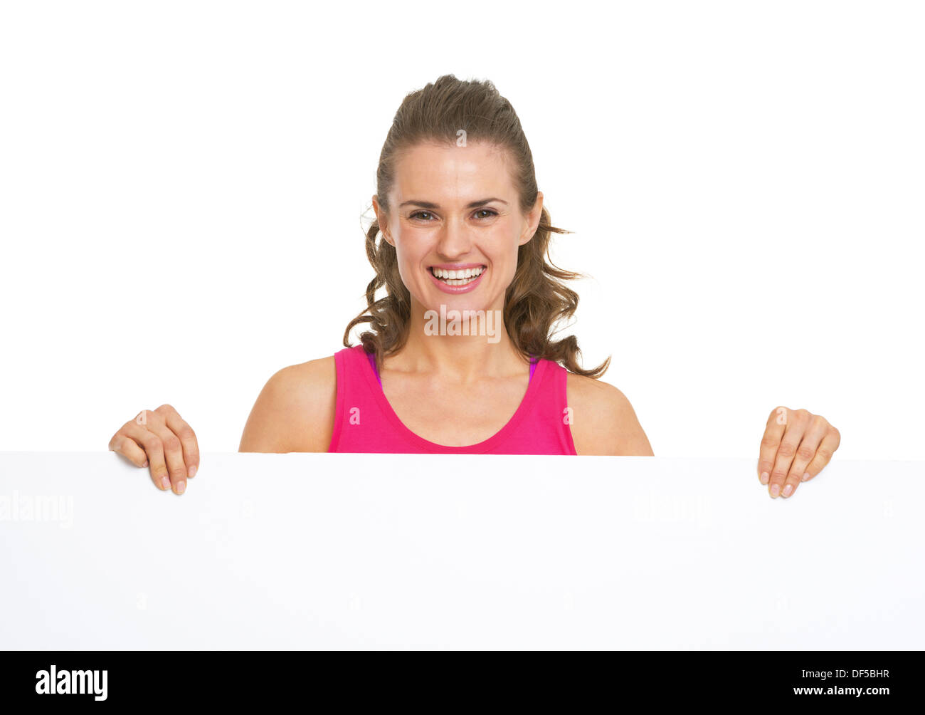 Happy fitness young woman showing blank billboard Stock Photo - Alamy Happy fitness young woman showing blank billboard Stock Photo - Alamy