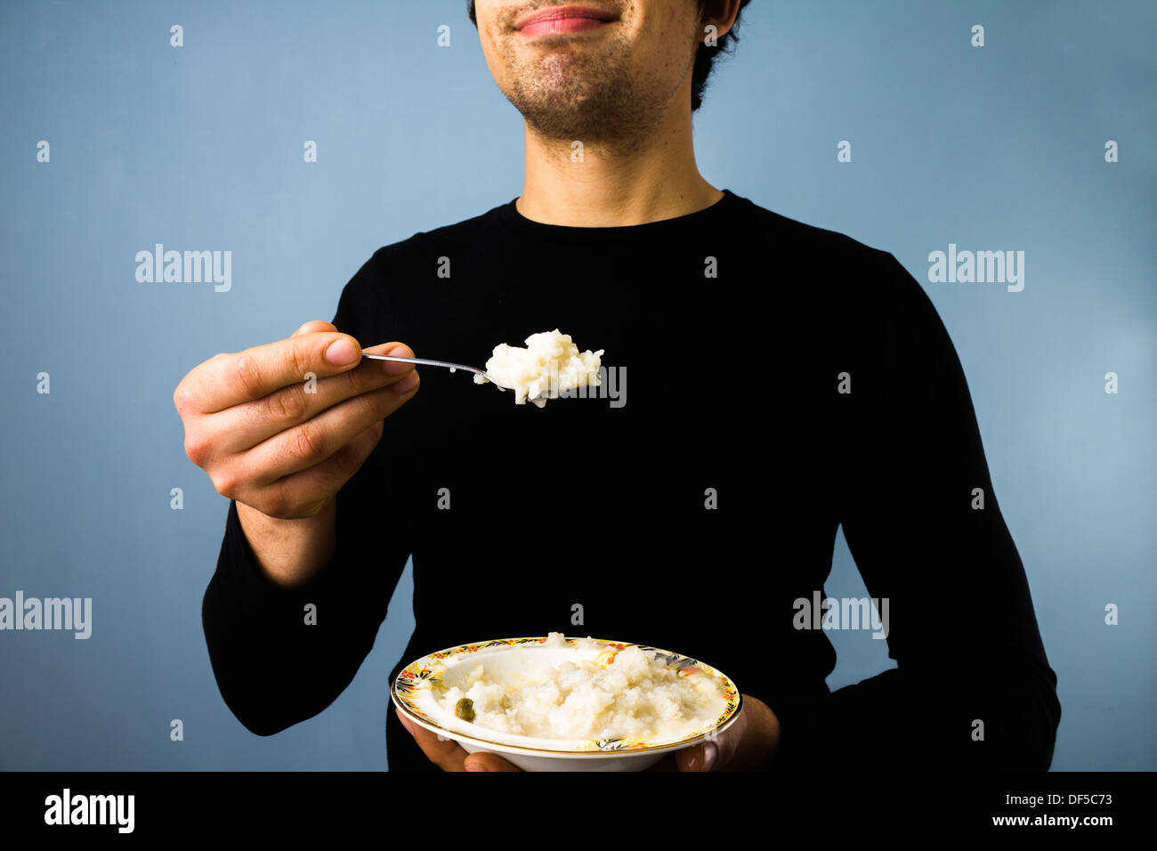 Man eating rice hi-res stock photography and images - Alamy