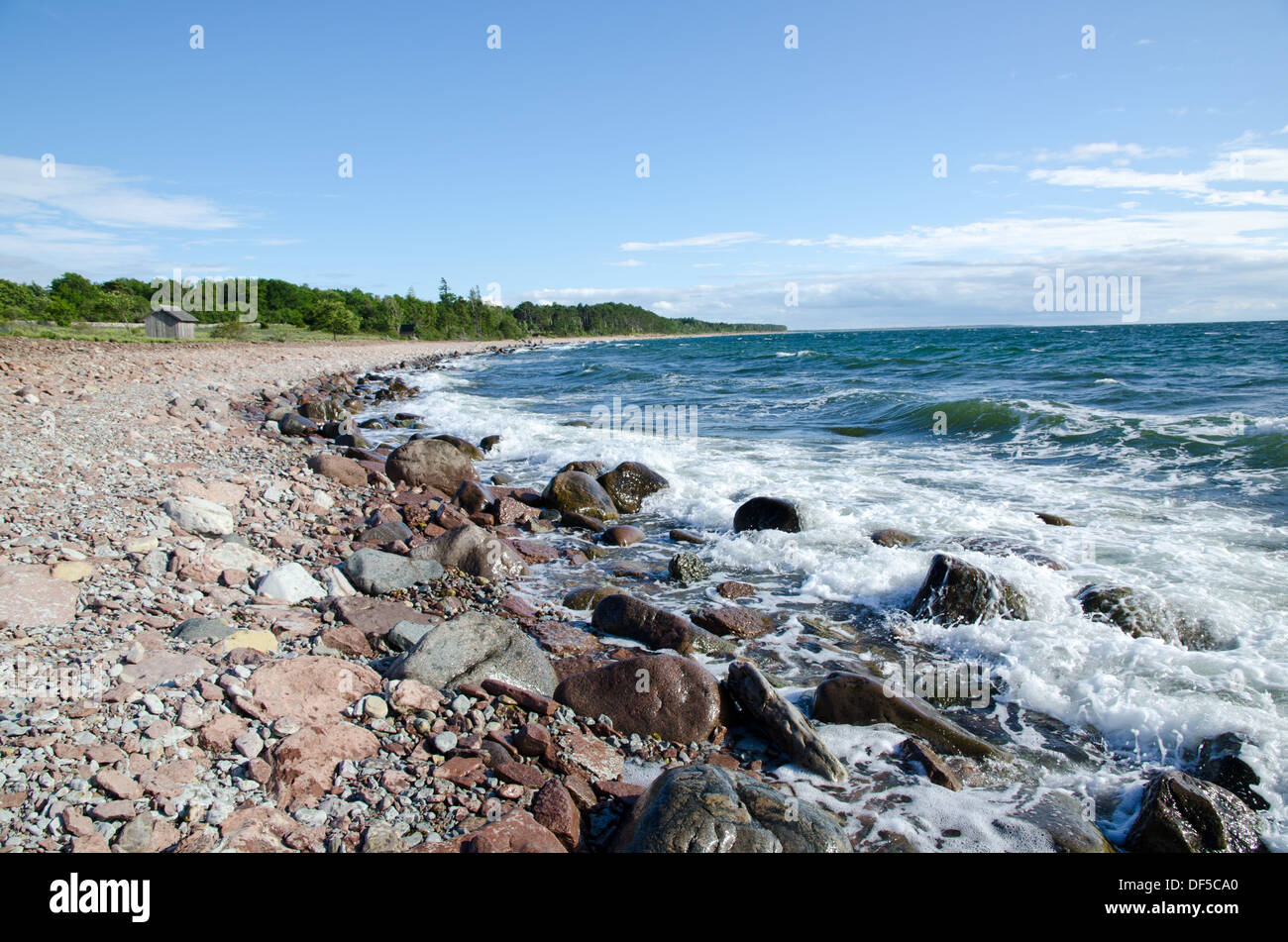 Coast with rocks and a small house Stock Photo - Alamy