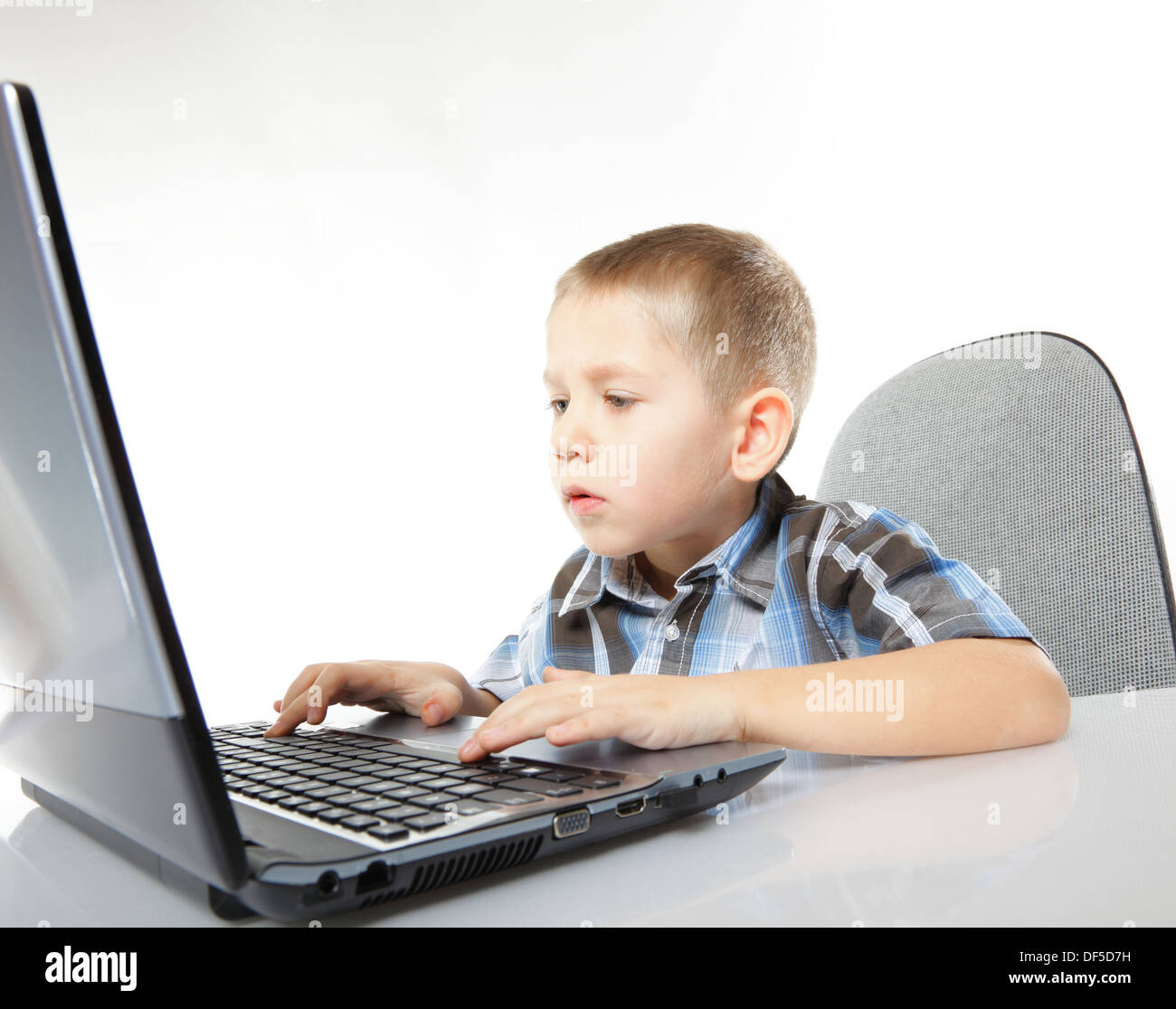 Computer addiction child boy with laptop notebook white background ...