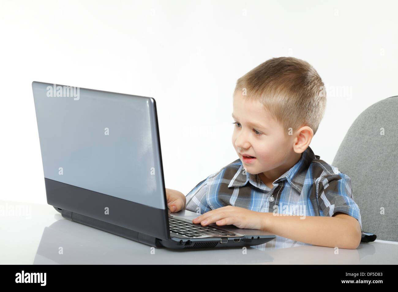 Computer addiction child boy with laptop notebook white background ...