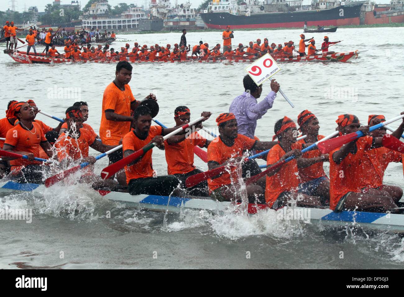 Bangladeshi men row a boat during a traditional boat race on the ...