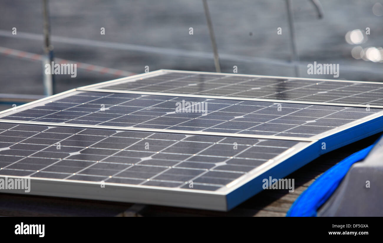 Solar charging batteries aboard a sail boat. Photovoltaic panels ...