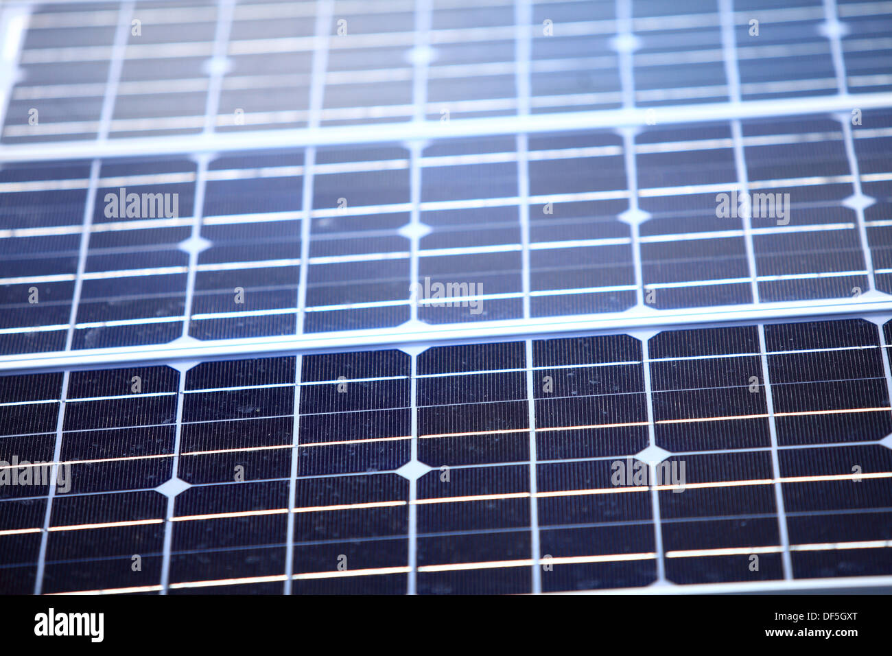 background of blue solar photovoltaic panels, charging batteries ...