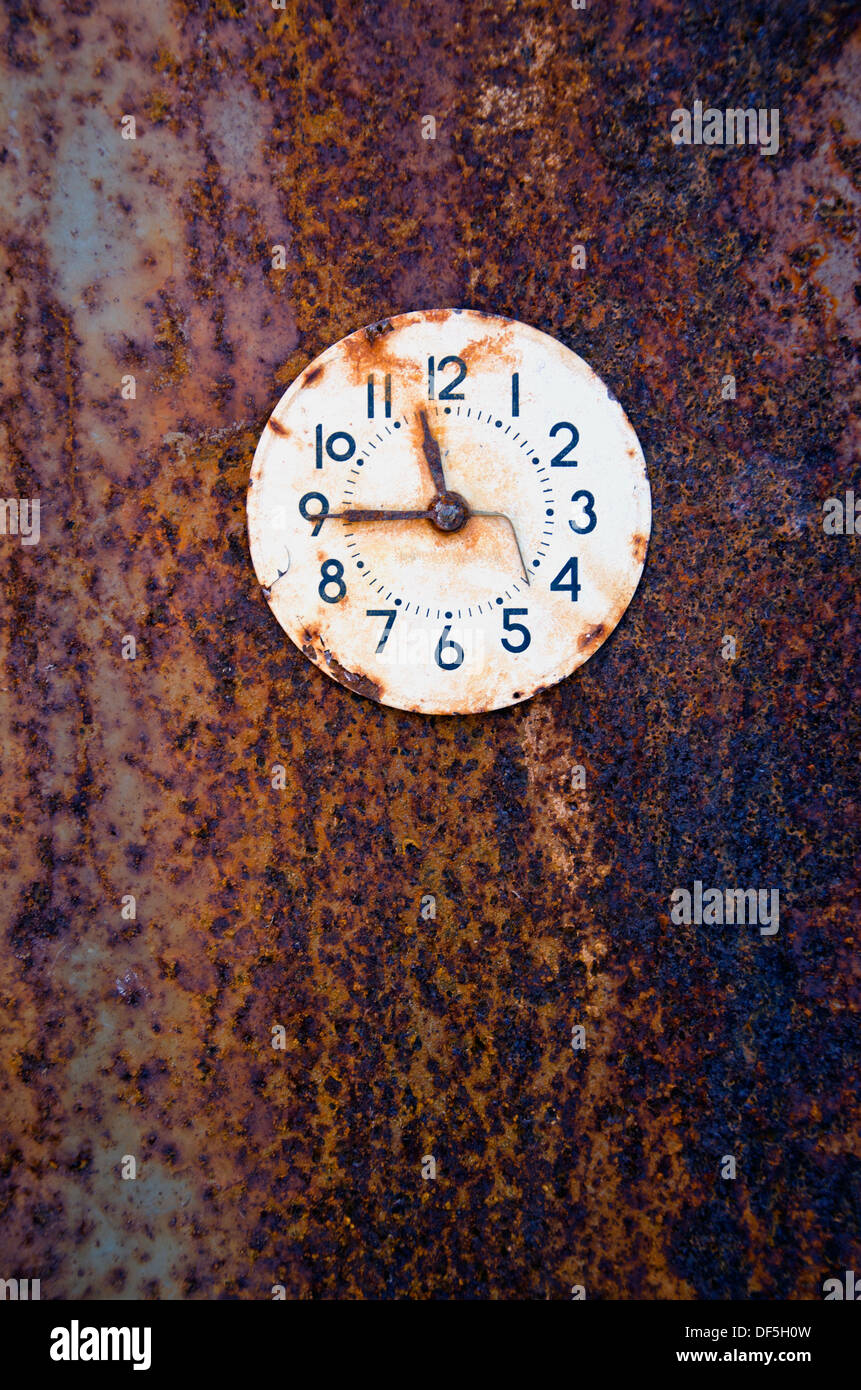 rusted ancient clock face on metal tin background. Time concept Stock ...