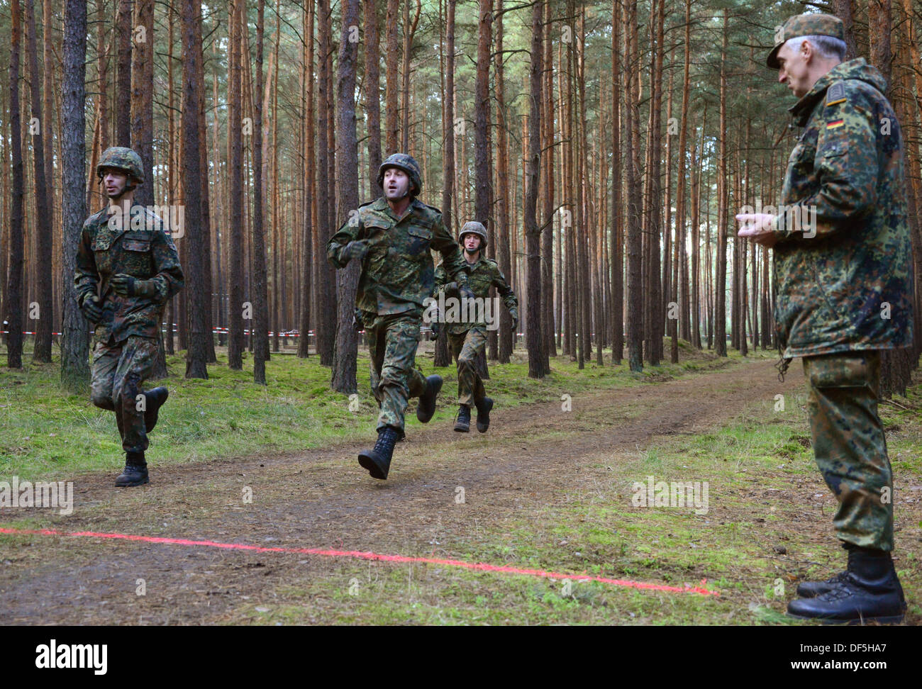 Reservists complete a forest obstacle course during an exercise at ...