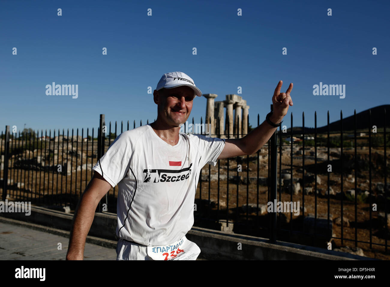 Sparta, Greece. 27th Sep, 2013. Runner walks past an ancient temple in ...