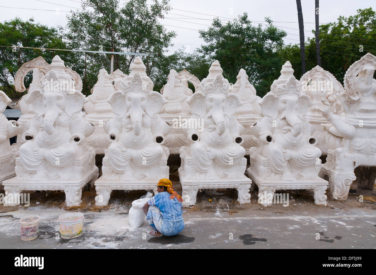 Workers in India making idols in makeshift factories on the side of the ...