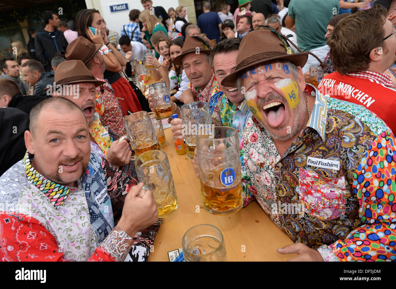 Munich, Germany. 28th Sep, 2013. Visitors drink beer and celebrate at ...