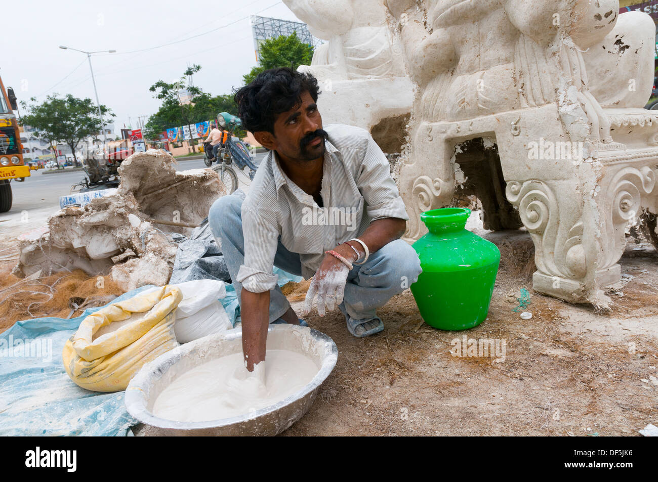 Workers in India making idols in makeshift factories on the side of the ...