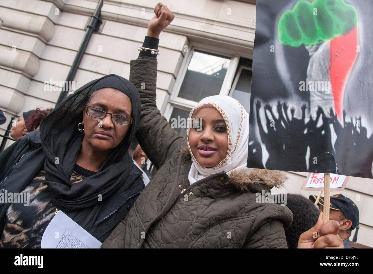 London, UK. 28th Sep, 2013. Women pose for the camera as Sudanese ...