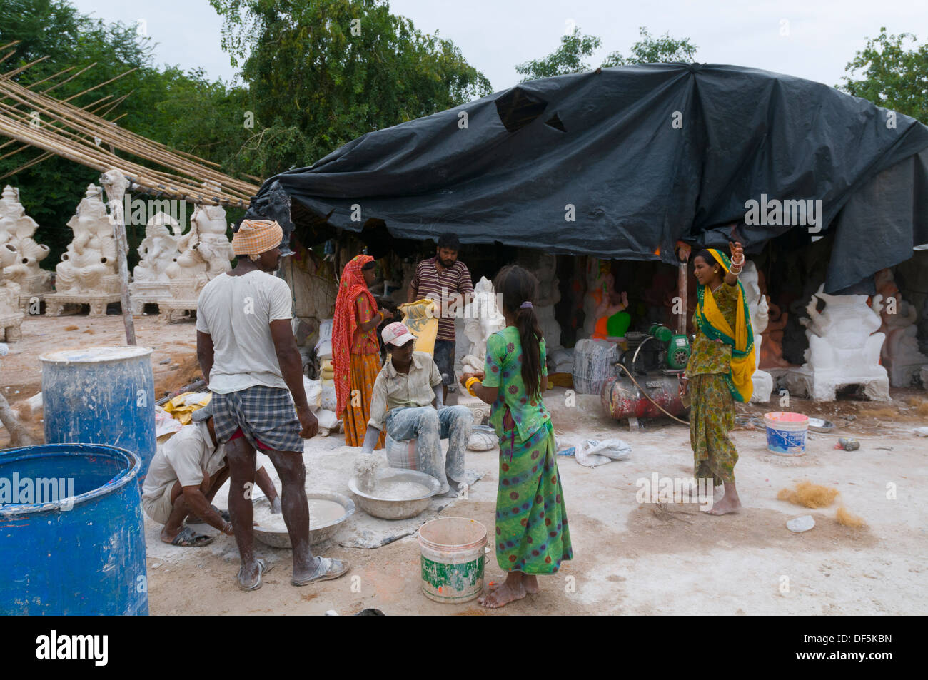 Workers in India making idols in makeshift factories on the side of the ...