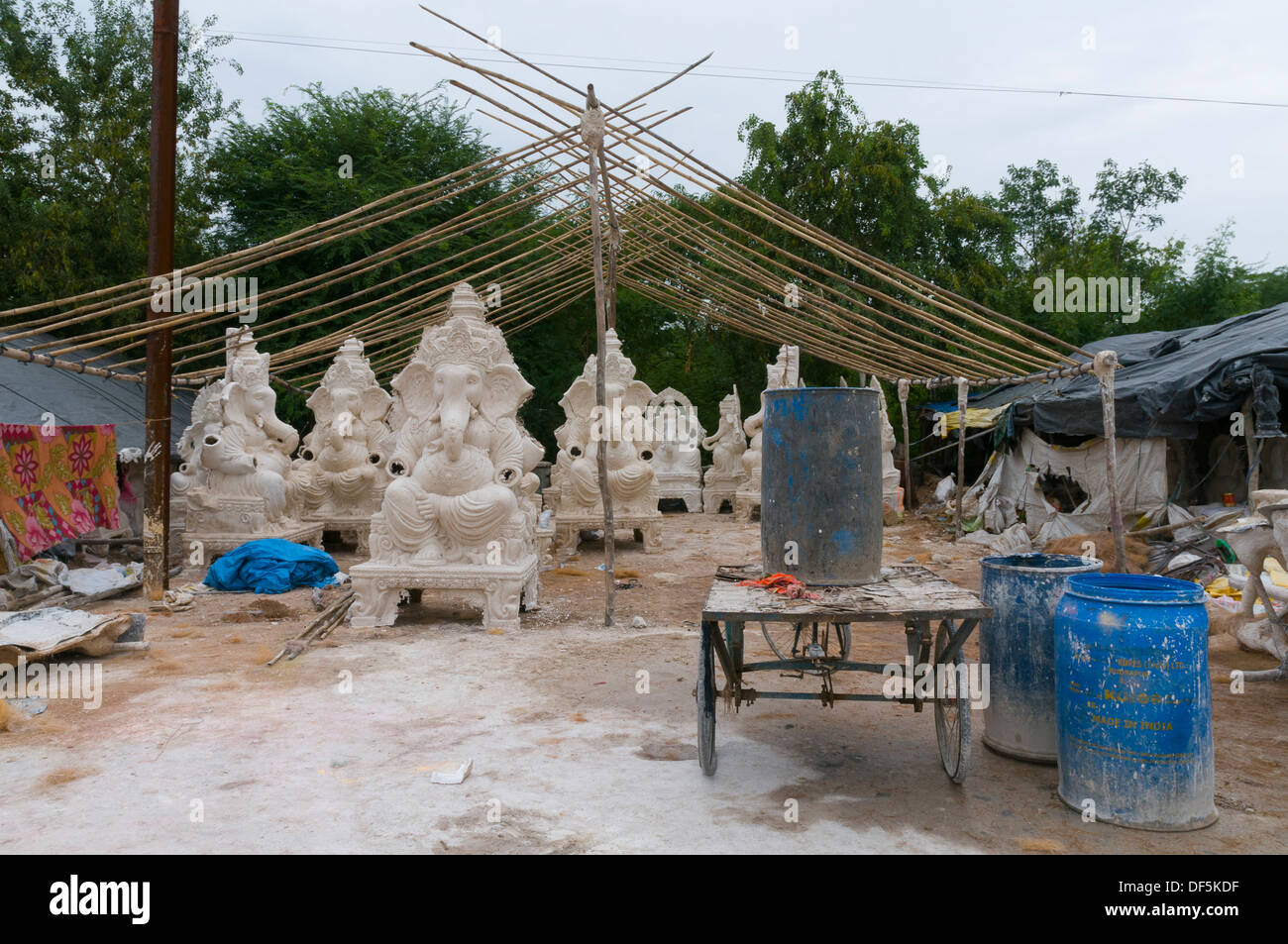 Workers in India making idols in makeshift factories on the side of the ...