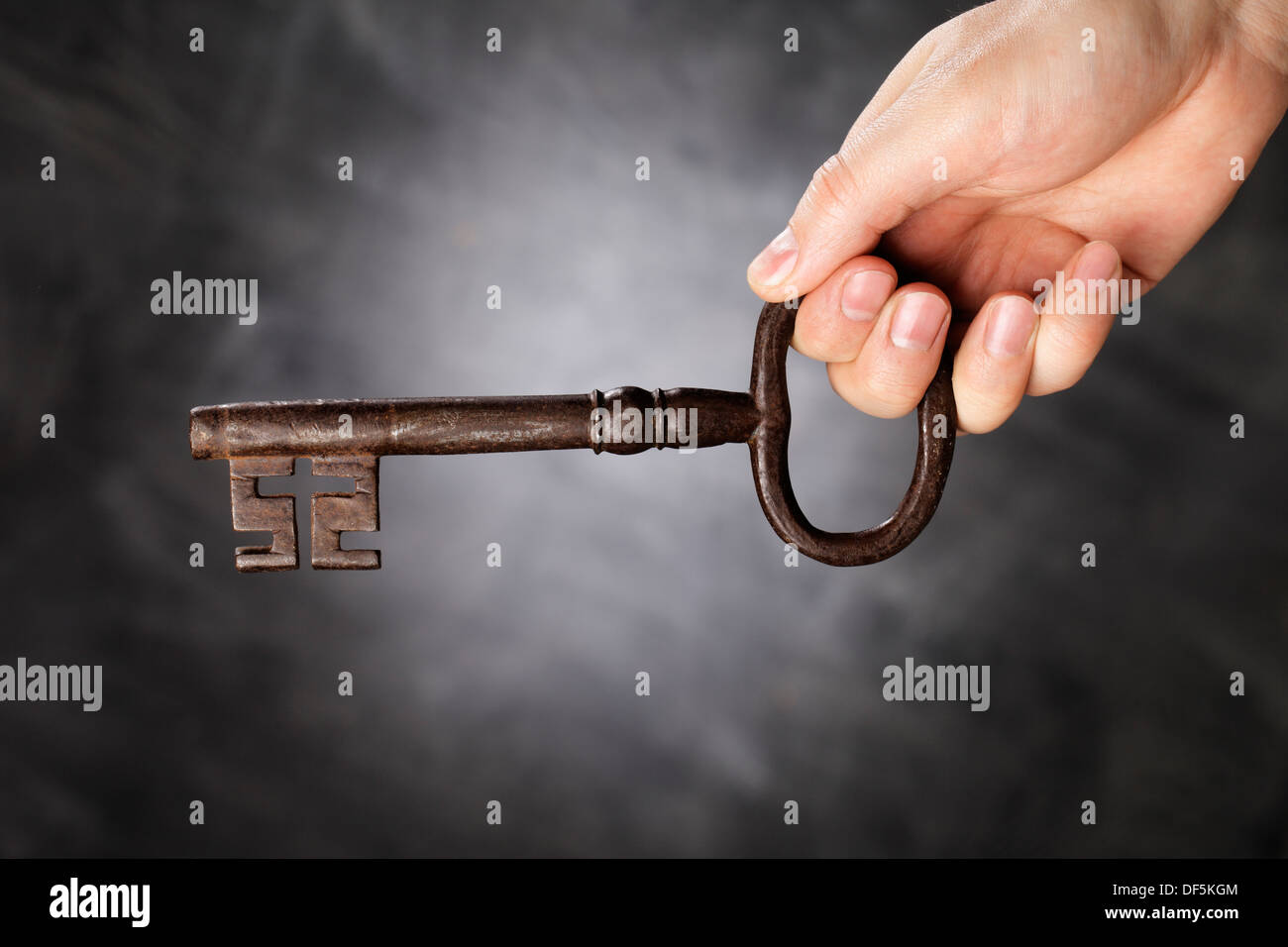 Hand holding skeleton key hi-res stock photography and images - Alamy