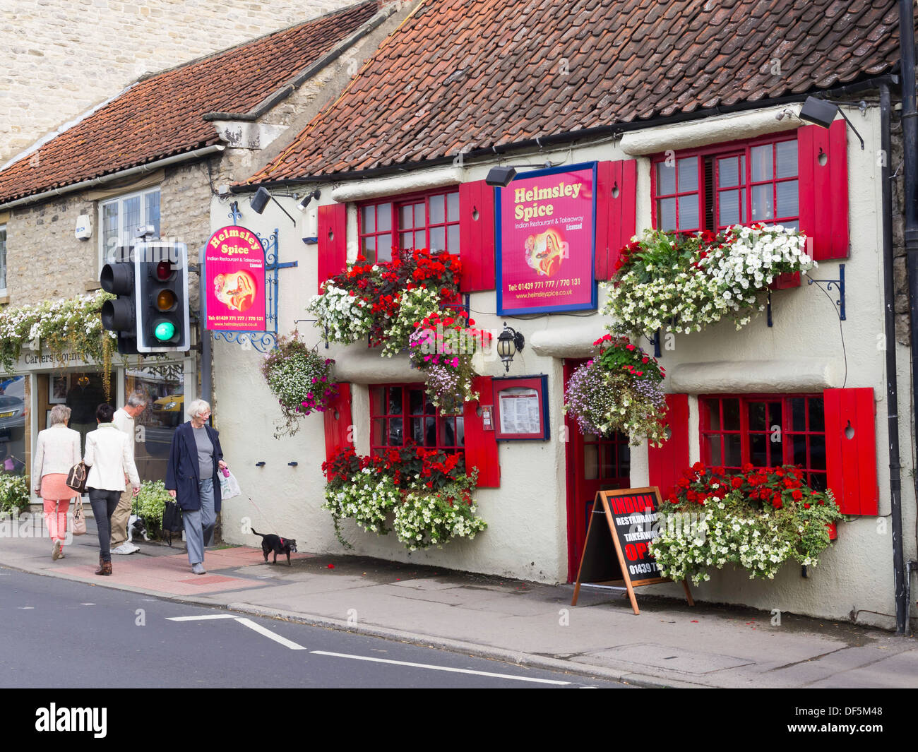 Bright red painted Indian Restaurant and take-away in the historic ...