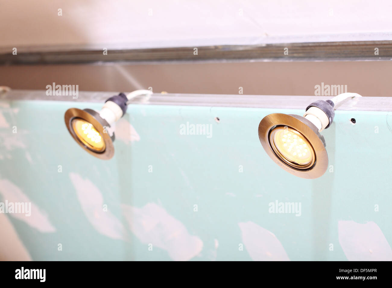 Electrical installation at construction site. Installing energy light ...