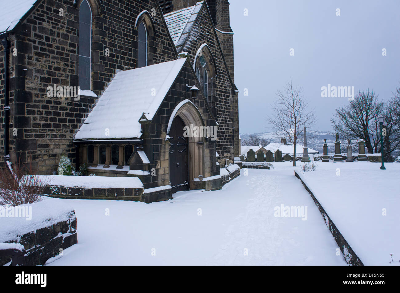 Cold, grey winter scene with snow falling on St. John's Church ...