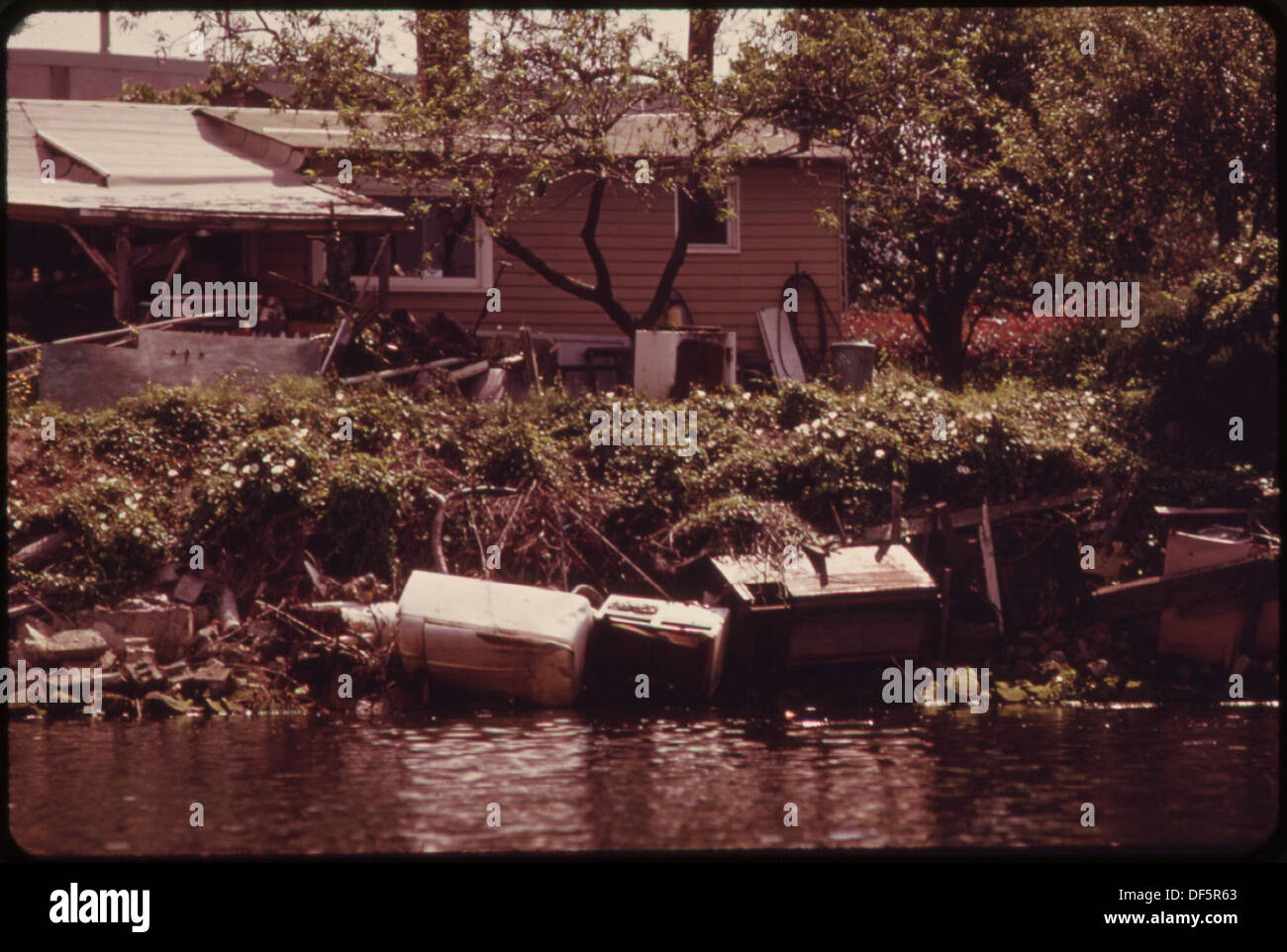 HOMEOWNER ON DUWAMISH RIVER USES DISCARDED REFRIGERATOR WASHING MACHINE ...