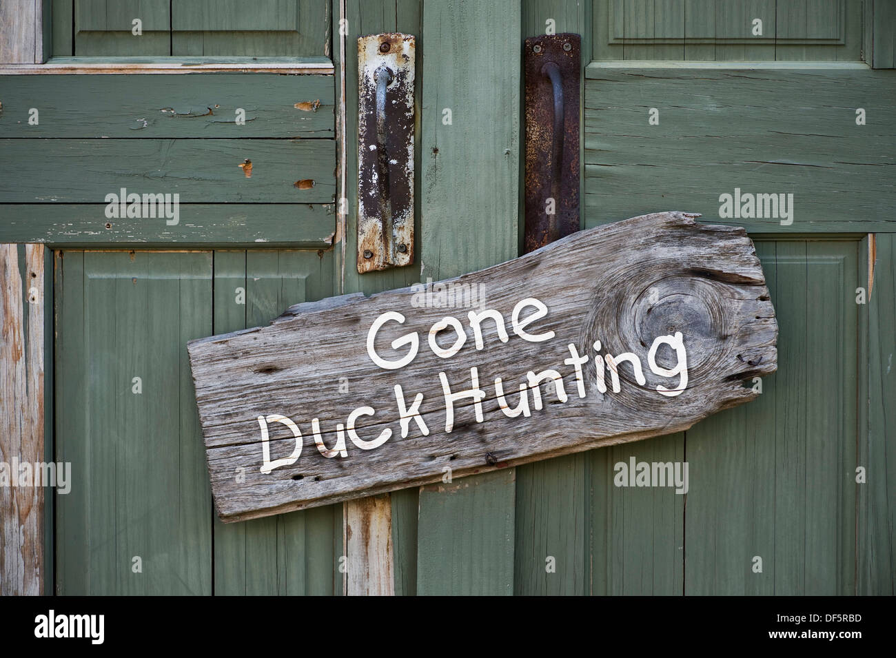 Old gone duck hunting sign on doorway Stock Photo - Alamy