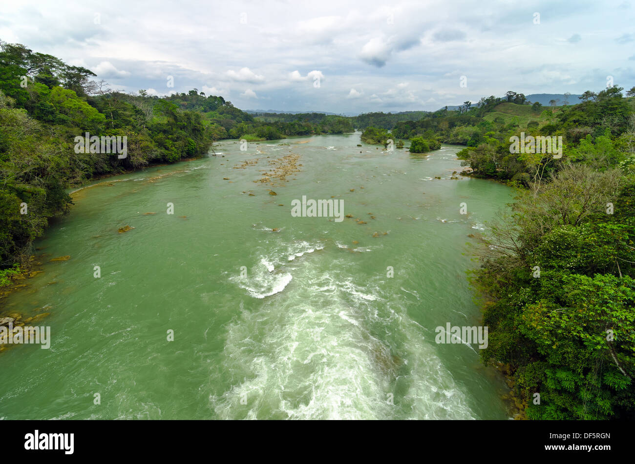 Wide green river running through the wilderness of Chiapas, Mexico ...