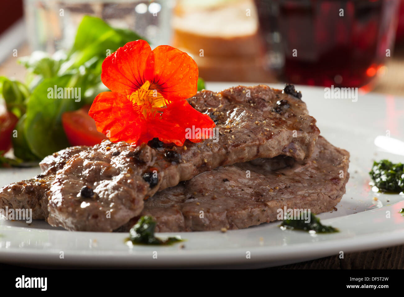grilled steak with indian cress flower Stock Photo - Alamy