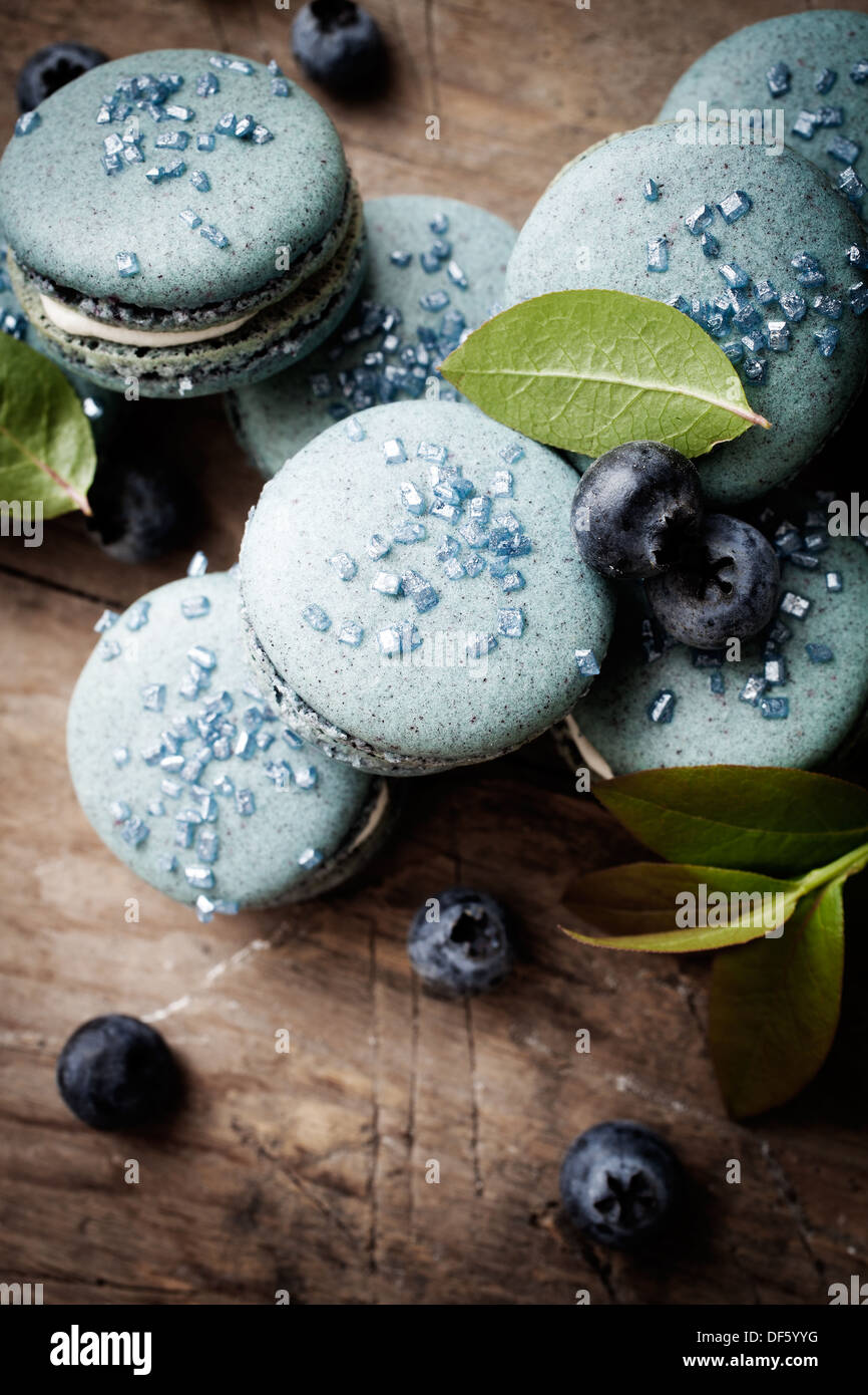 Close up of blueberry macaroons with white filling Stock Photo - Alamy