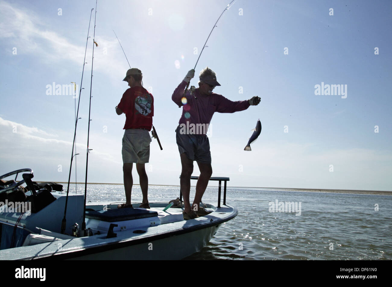 Silhouette Two Men Holding Fishing High Resolution Stock Photography ...