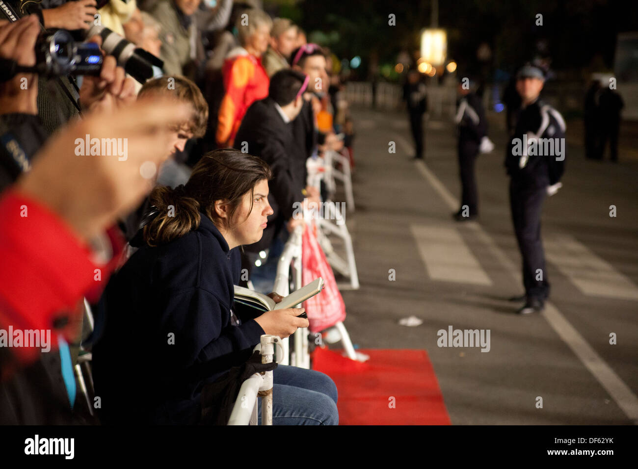 Autograph seekers wait for celebrities to arrive at the red carpet at ...