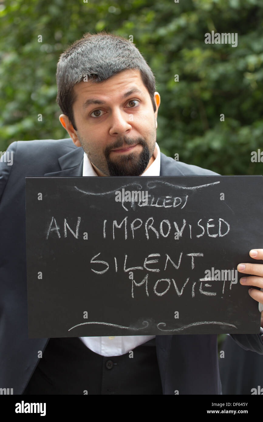 A young actor promoting his production on the High Street at the ...