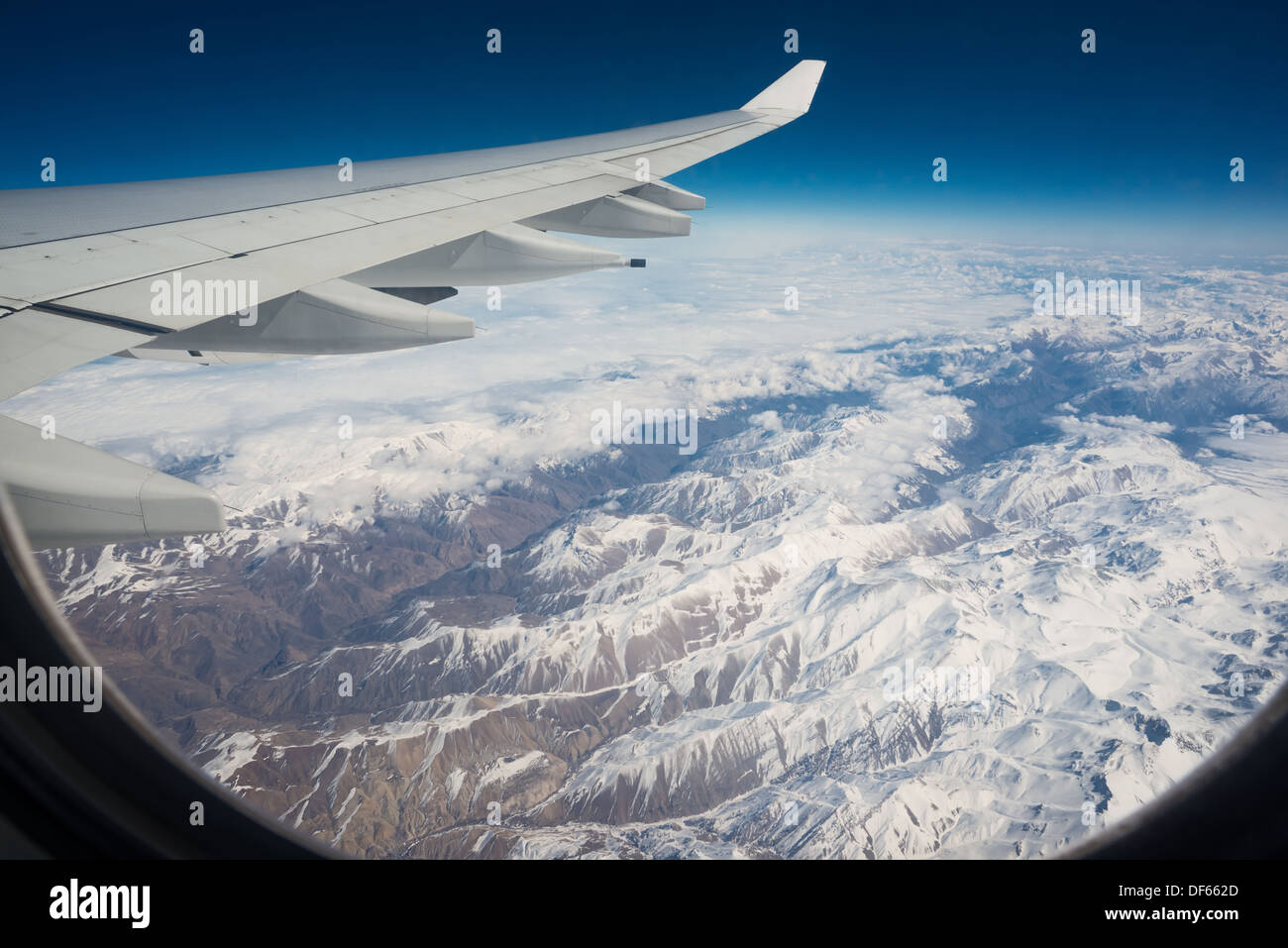 view of airplane wing over snow mountains, landscape Stock Photo - Alamy