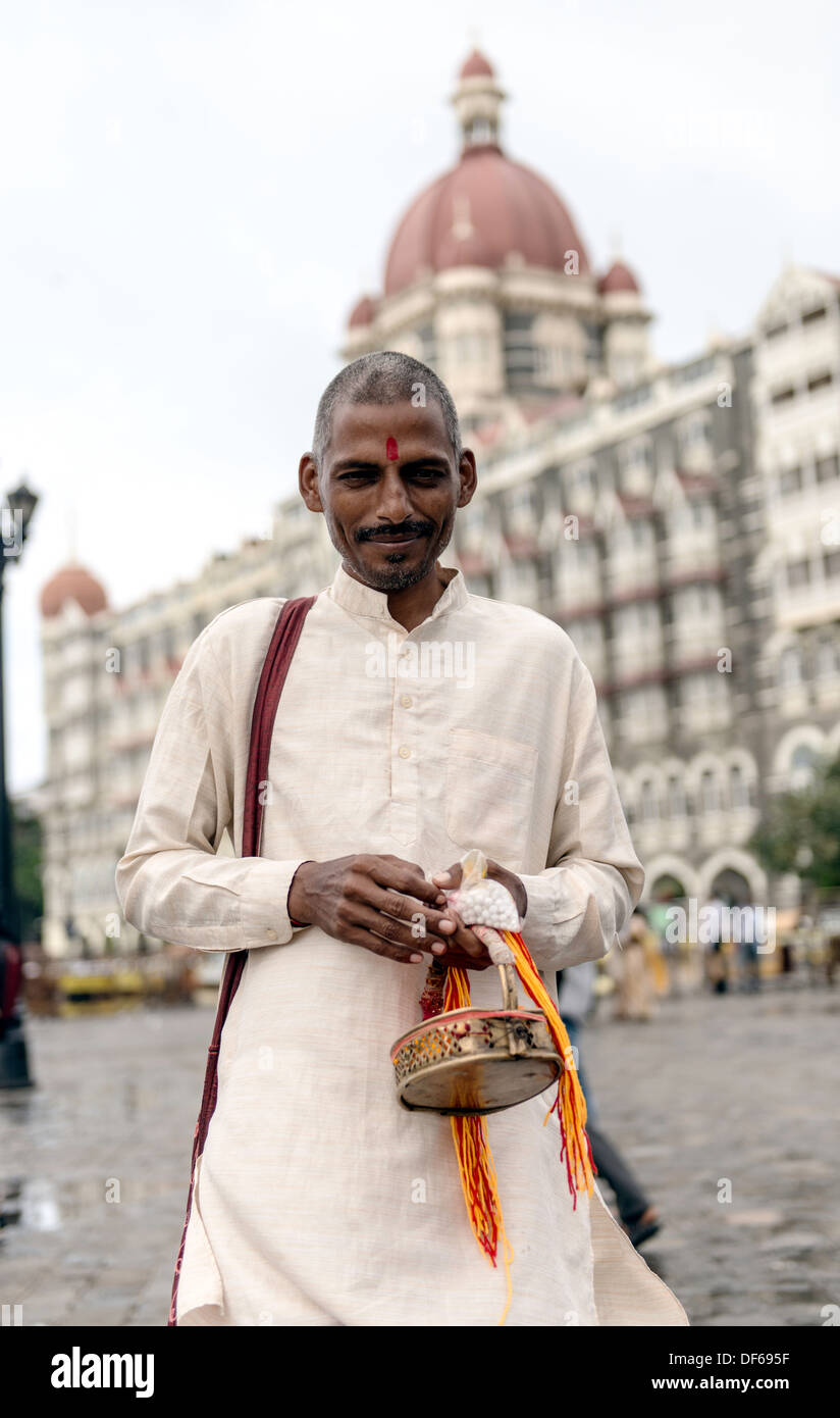 Portrait of Indian man with The Taj Mahal Palace Hotel in the ...