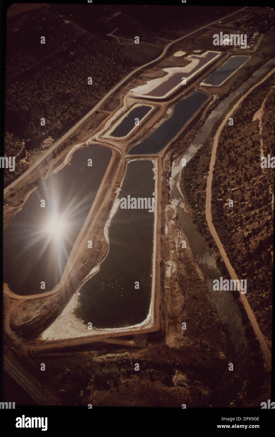 HOLDING POND AT URANIUM PROCESSING MILL. (FROM THE DOCUMERICA-1 ...
