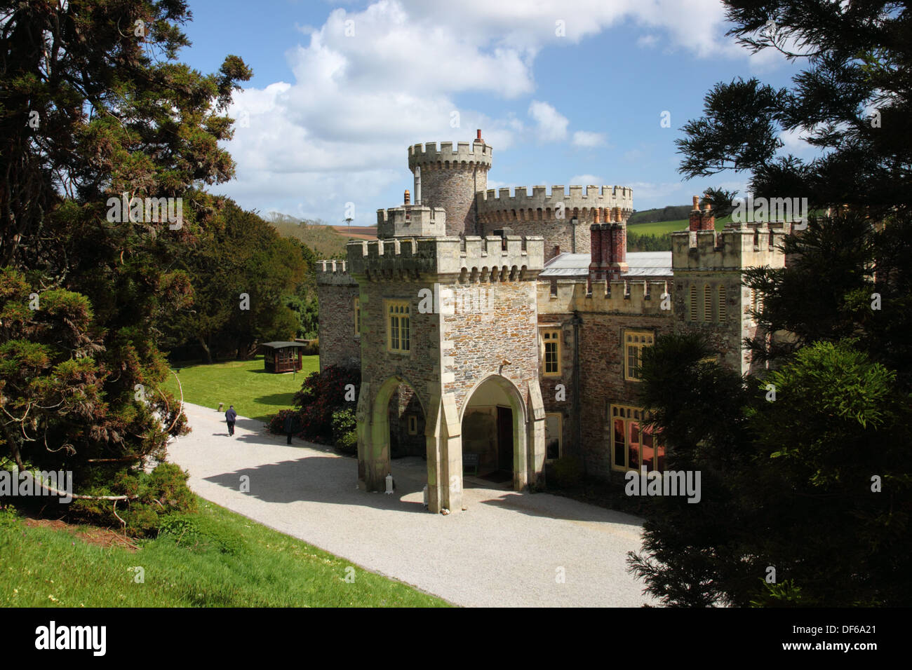 A Gothic castle with a drive, turrets, lawns, and trees Stock Photo - Alamy