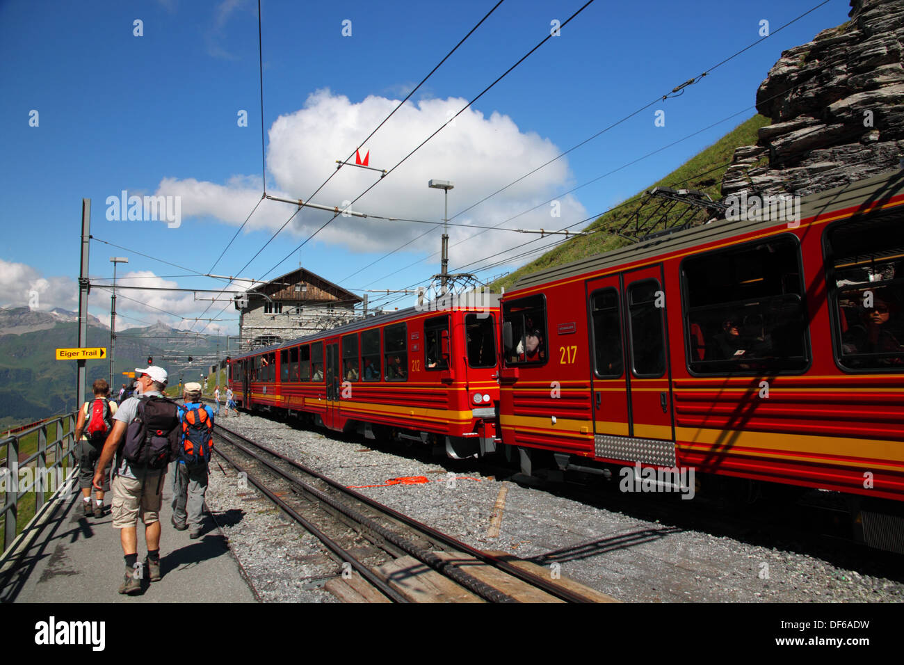 A red Jungfrau Railways train at the Eigergletscher station with ...