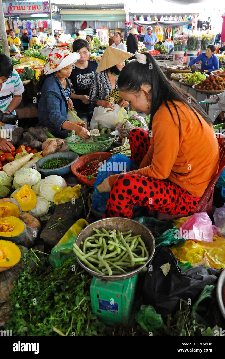 Indoor Vietnamese village market selling fruit, vegetables, fish and ...