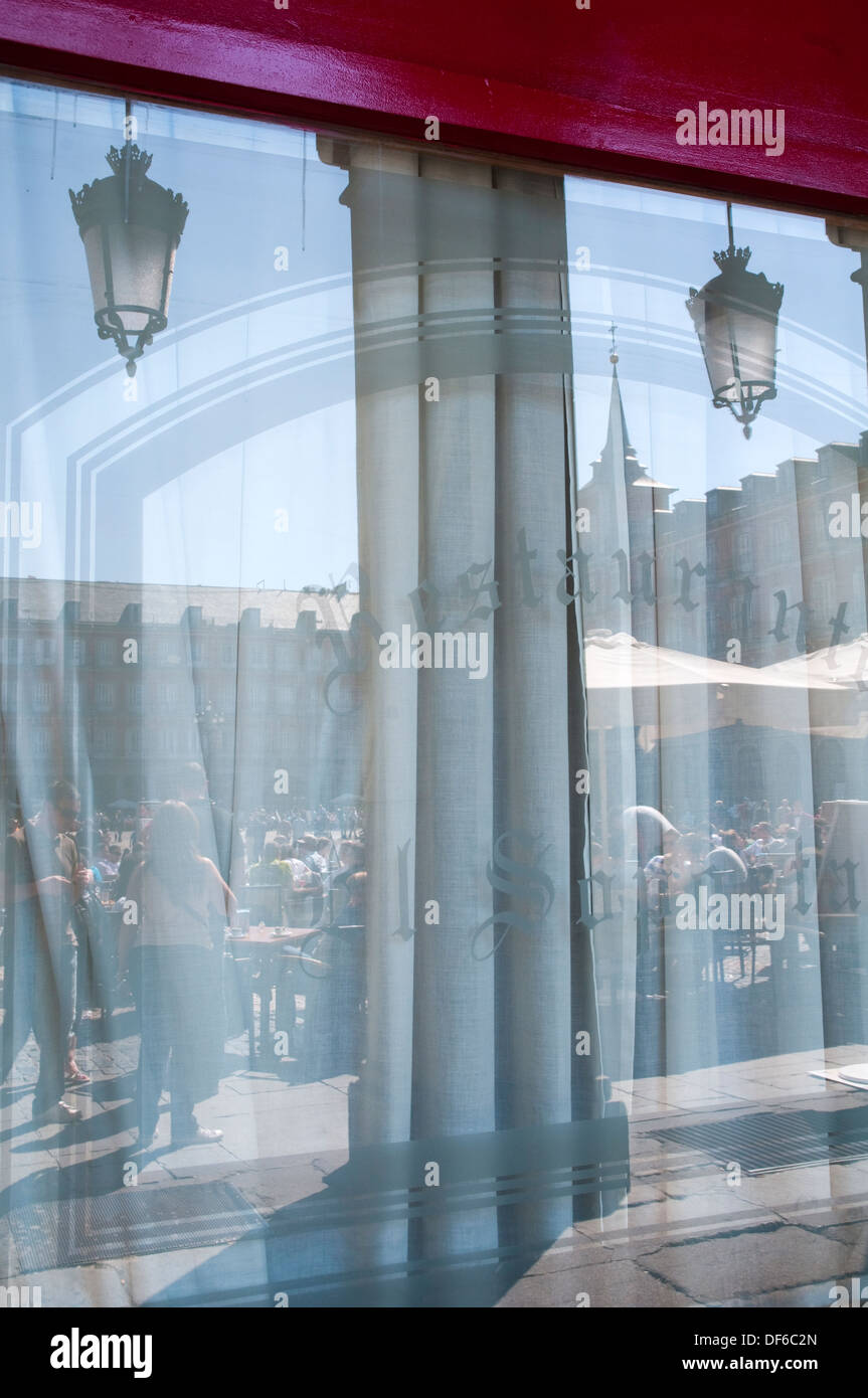 Main Square reflected on the window of a restaurant. Madrid, Spain ...