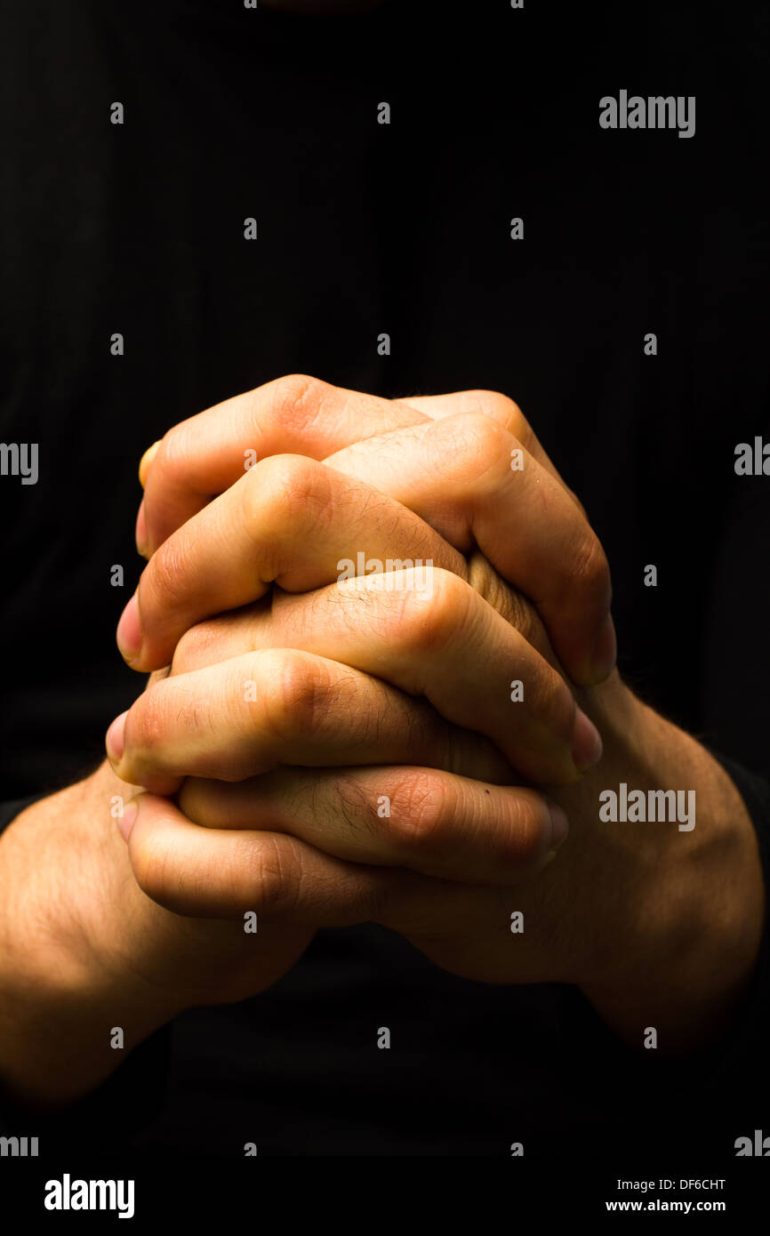 Hands folded in prayer hi-res stock photography and images - Alamy