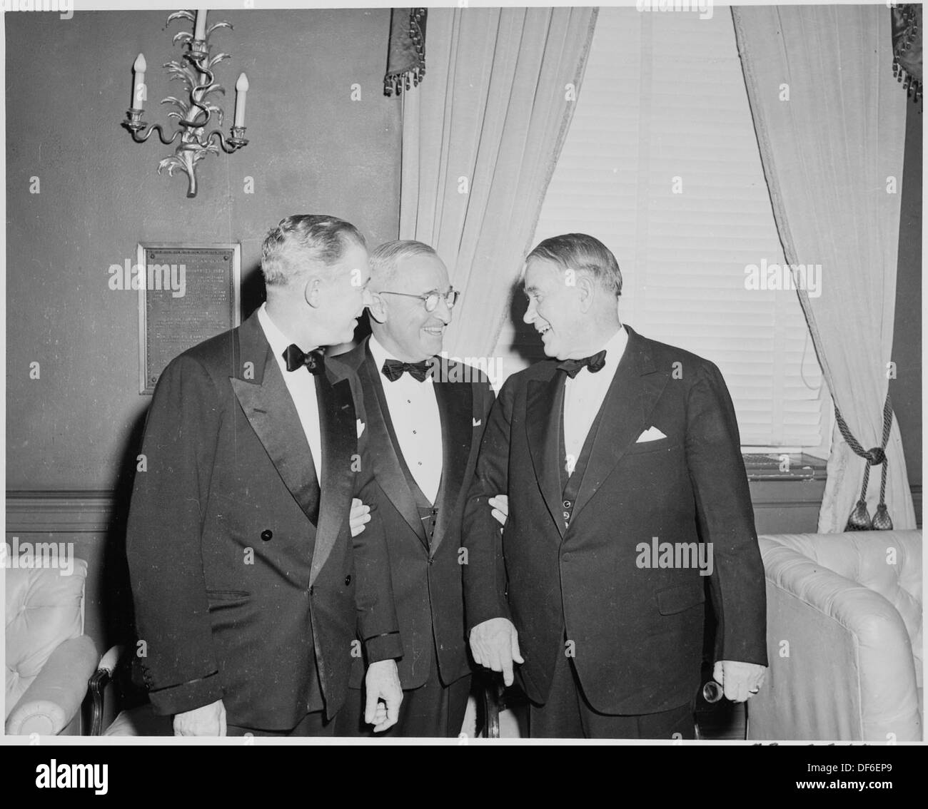 L to R, Unidentified man, President Harry Truman, and Vice President ...