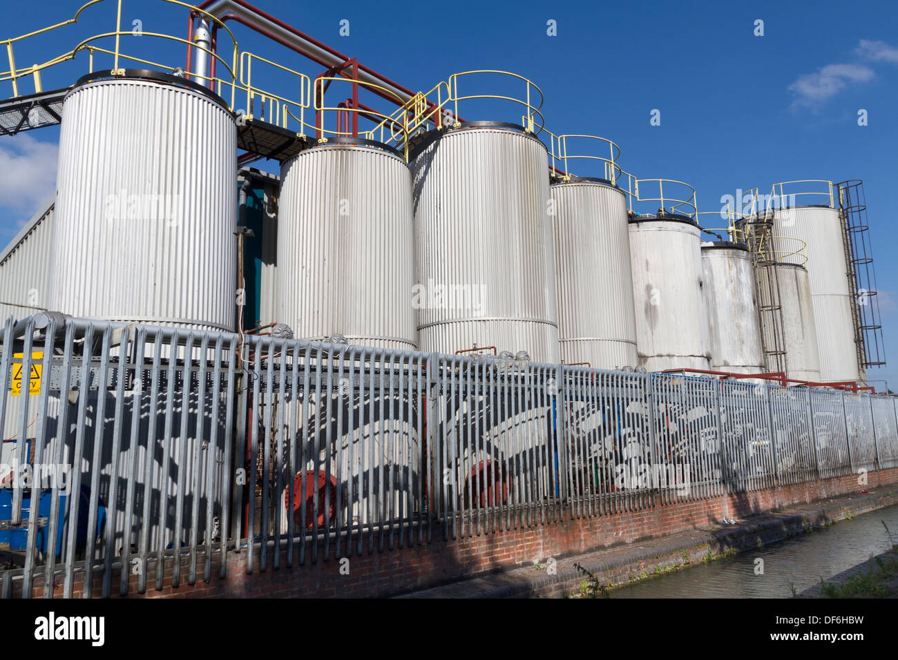 Storage tankers within a chemical works UK Stock Photo - Alamy
