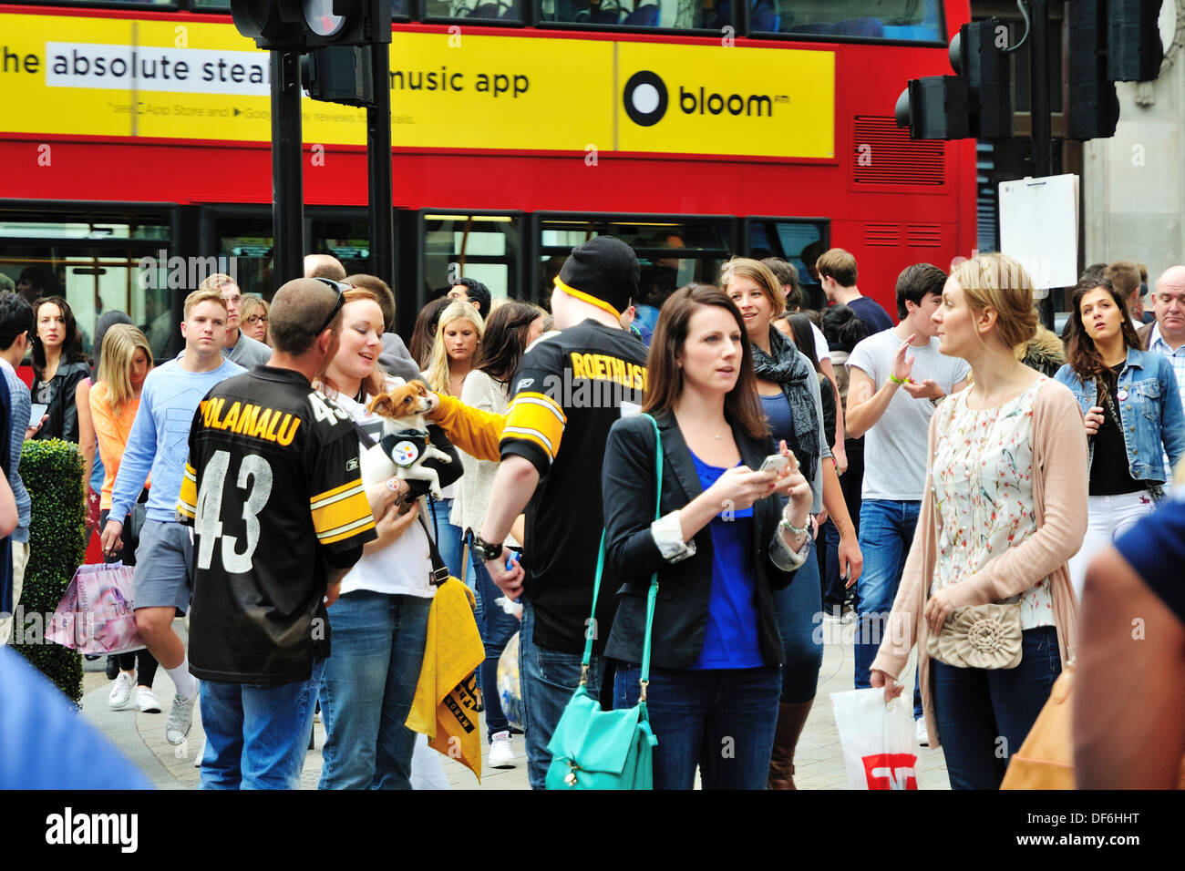 A group of Pittsburgh Steelers fans amongst the crowds of fans walking ...
