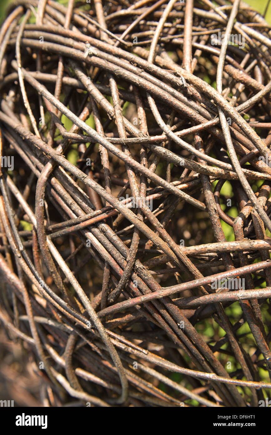 woven twigs branches of willow into network and mesh forming a barrier ...
