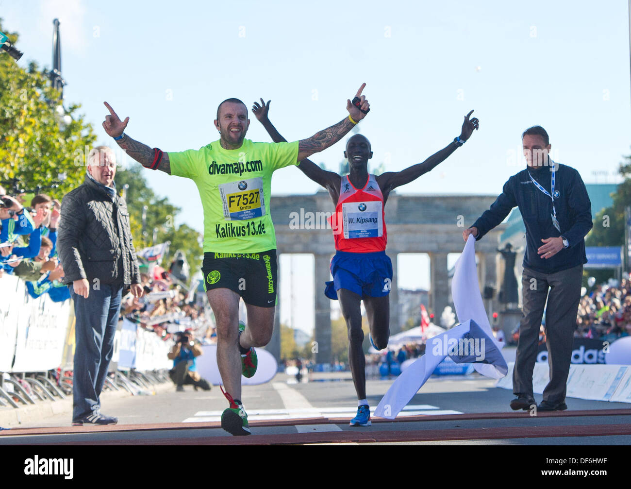 The winner of the Berlin Marathon, Wilson Kipsang (2-R), crosses the ...