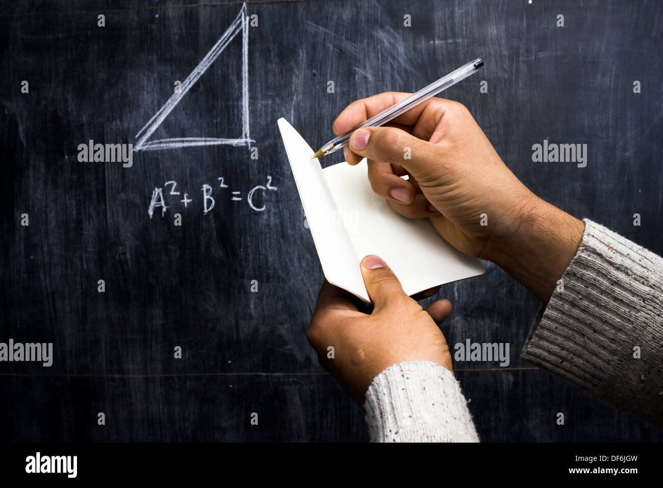 Young man taking notes of the Pythagorean theorem Stock Photo - Alamy